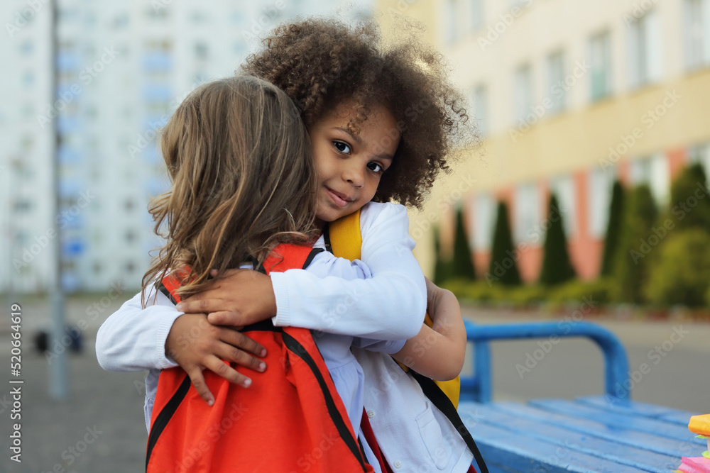 girls school friends support each other, hug and help to survive ...