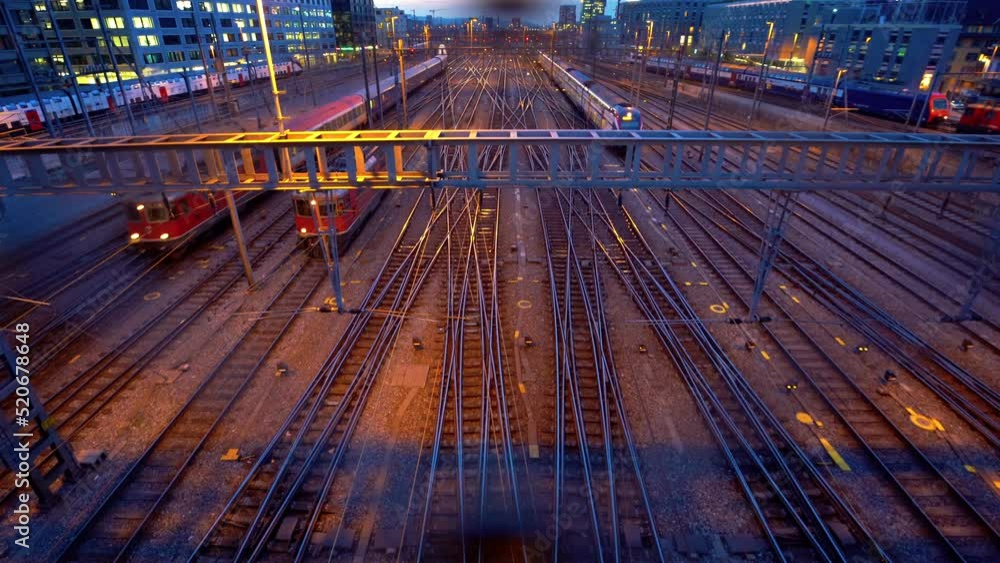 Two trains coming in the railway station via tracks of the Zurich main ...
