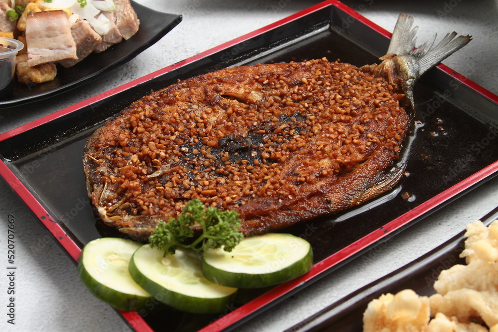 Freshly cooked Fried Boneless Bangus or fried boneless milkfish Stock ...