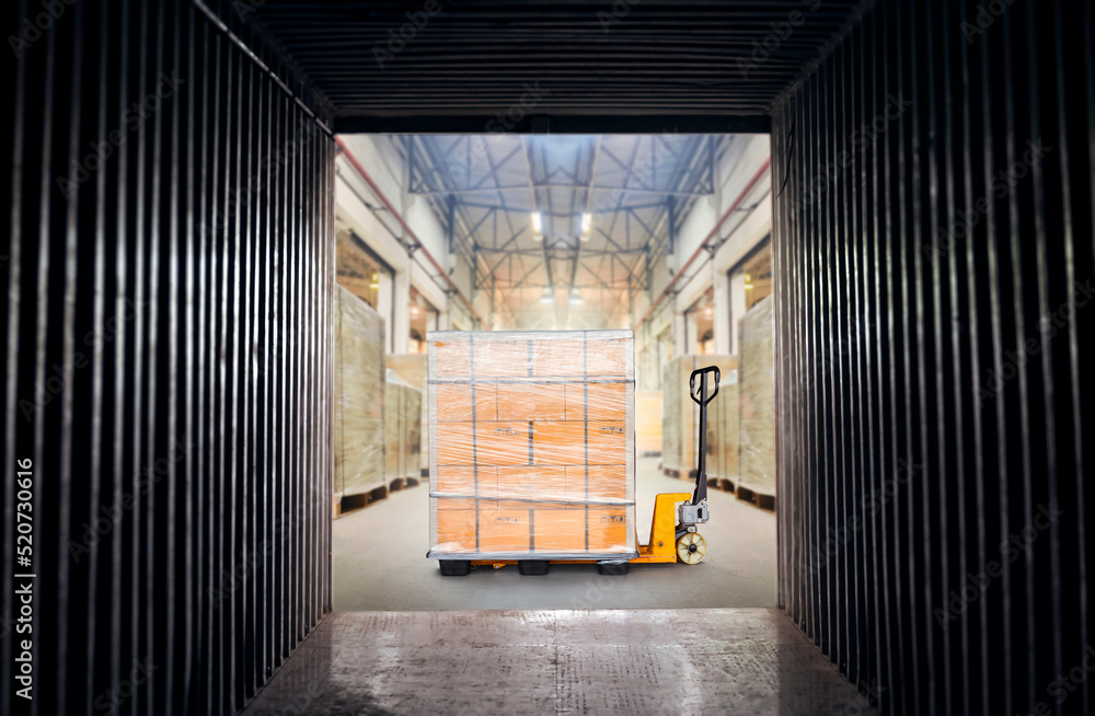 Inside Cargo Container with Packaging Boxes Stacked on Pallets. Loading ...
