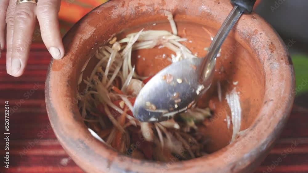 Cooking Som Tam Series: SLO MO Street food vendor's hand mixing Som Tam ...