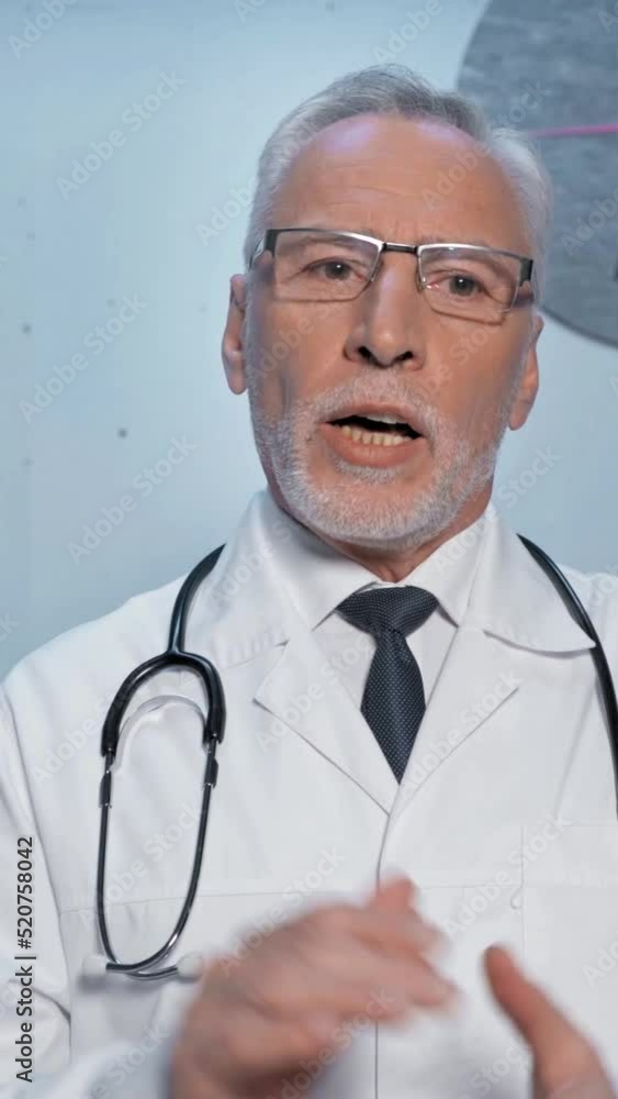 vertical video of confident doctor with stethoscope talking while ...
