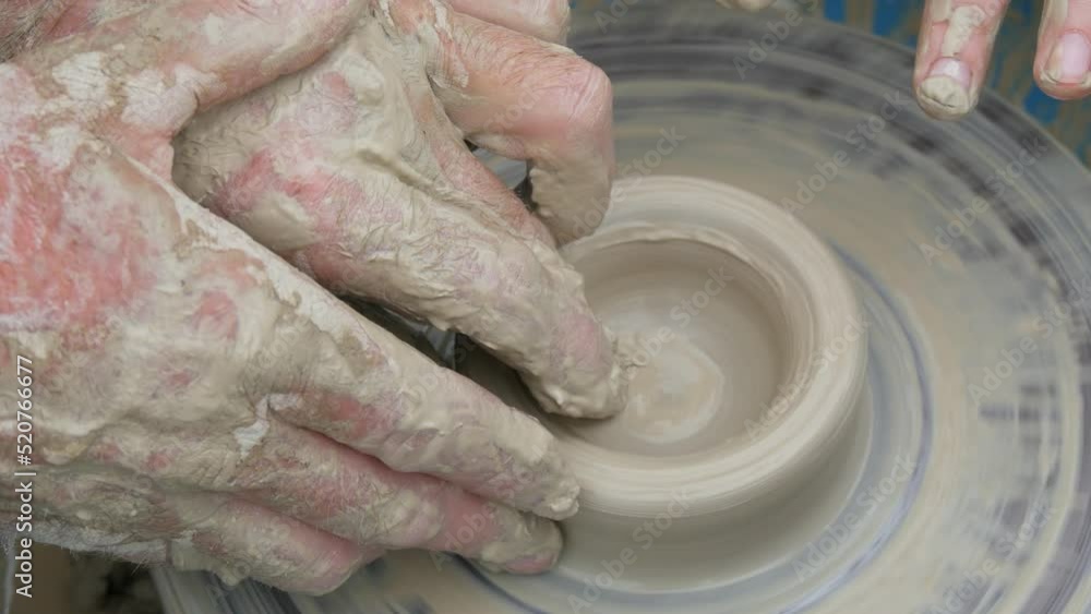 Clay modeling master class. Teacher show children hands clay pot ...