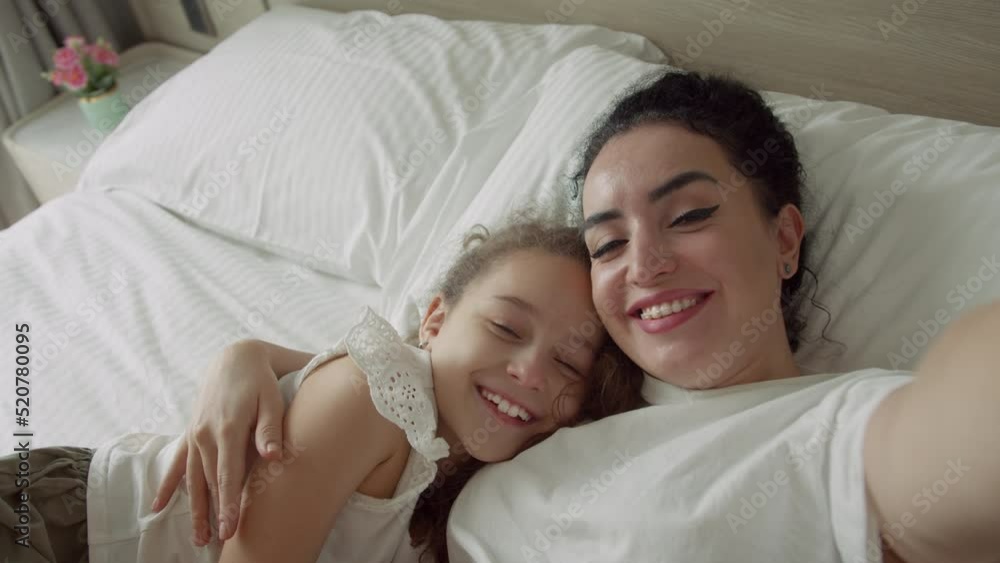 Portrait happy Cute funny cheerful mom and daughter gently hugging ...