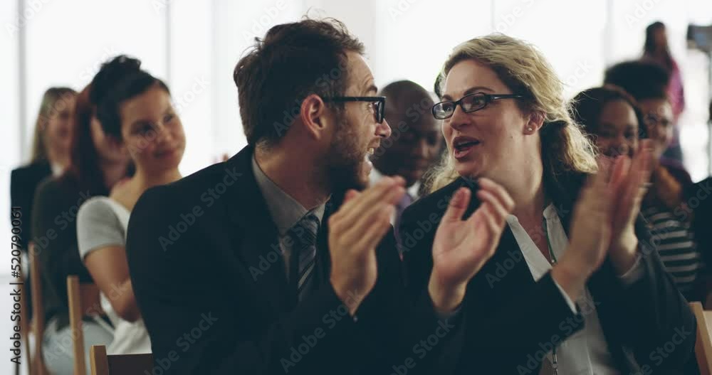 Business conference audience clapping, cheering and showing applause ...