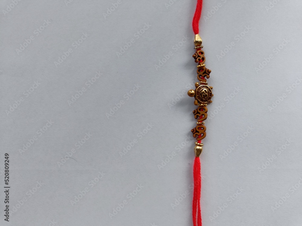 red coloured thread with om written,religious thread,colorful rakhis ...