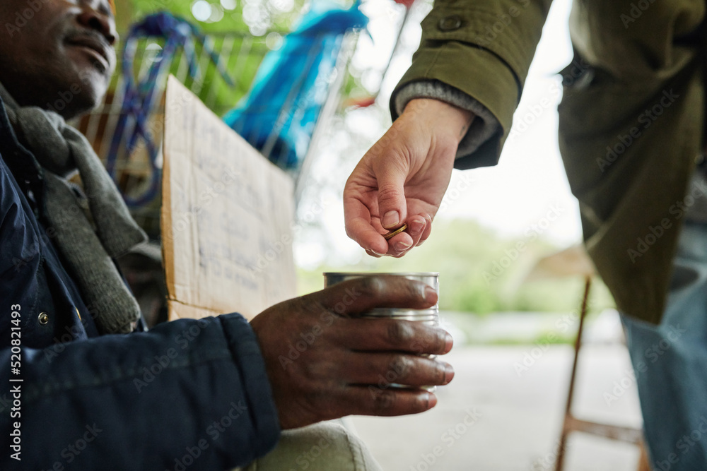 Man Giving Money To Homeless