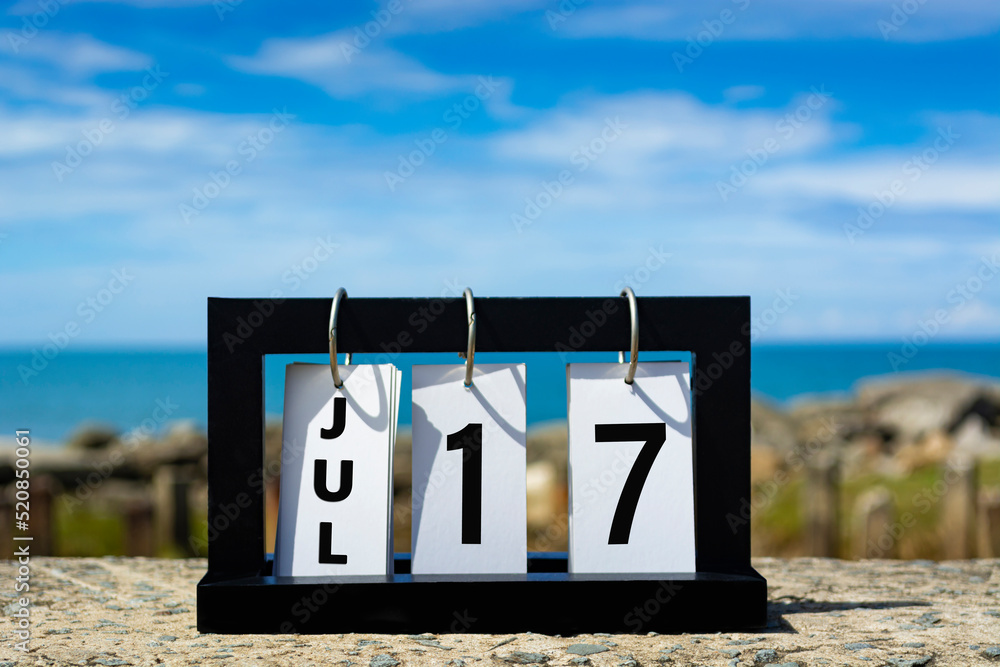 Jul 17 calendar date text on wooden frame with blurred background of ...