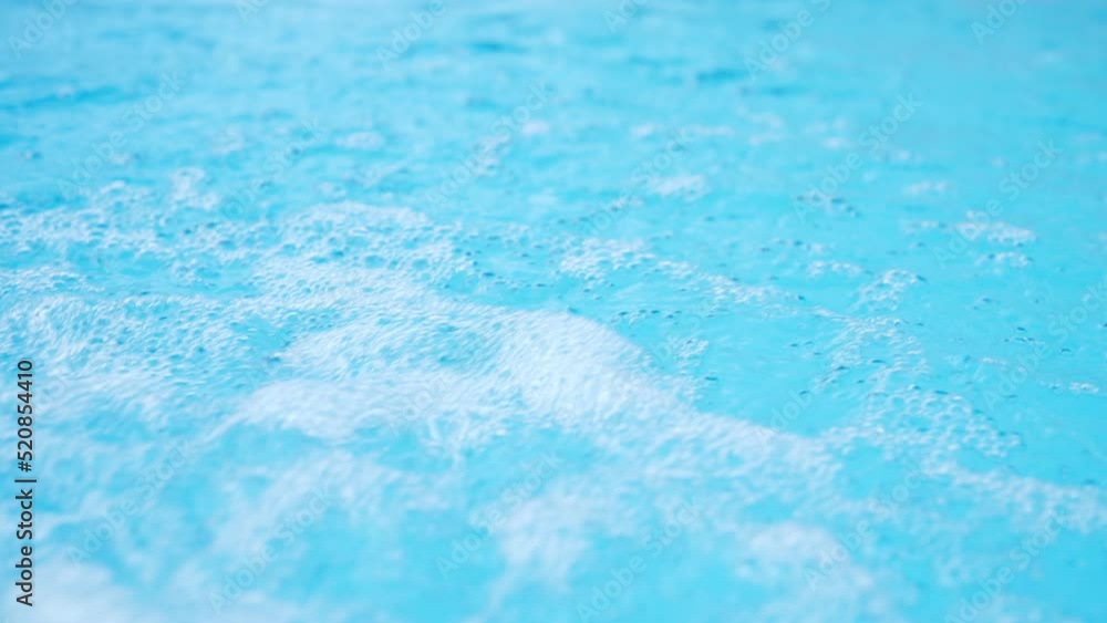 Clean azure water surface texture in slow motion. Swimming pool with ...