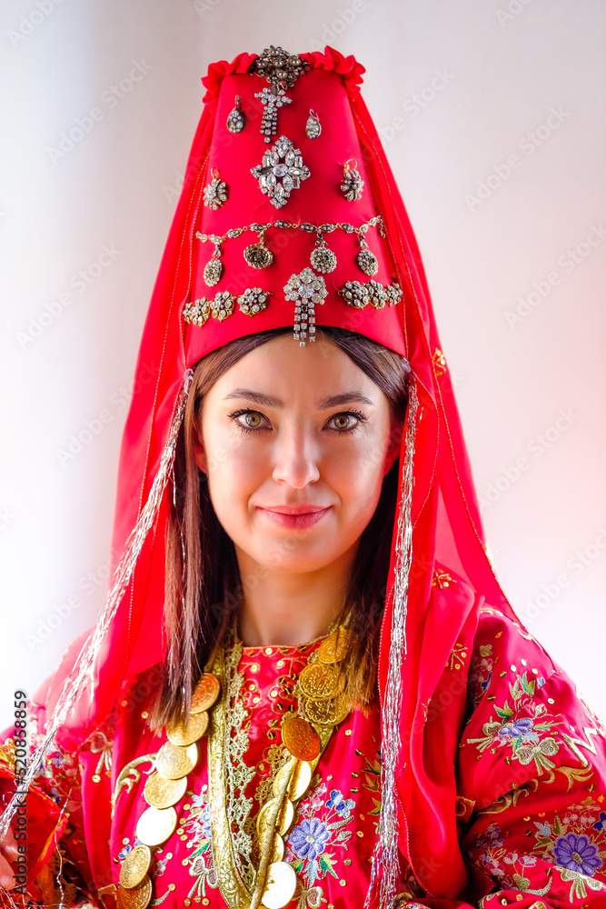 Young lady with her old style turkish traditional costume and headgear ...