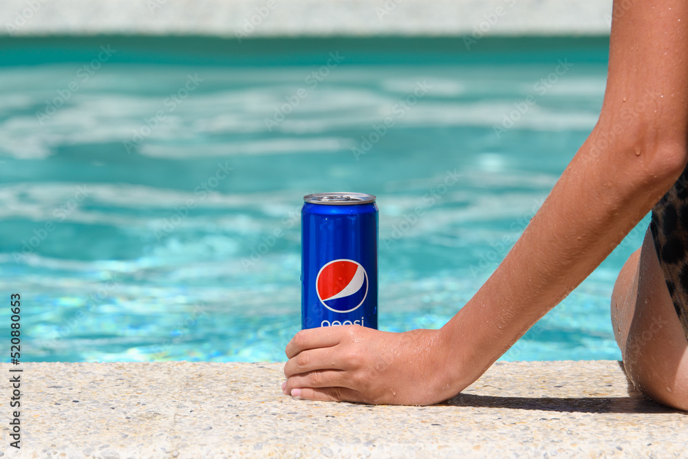 Novorossiysk - Russia, July 2022: A young girl is sitting by the pool ...