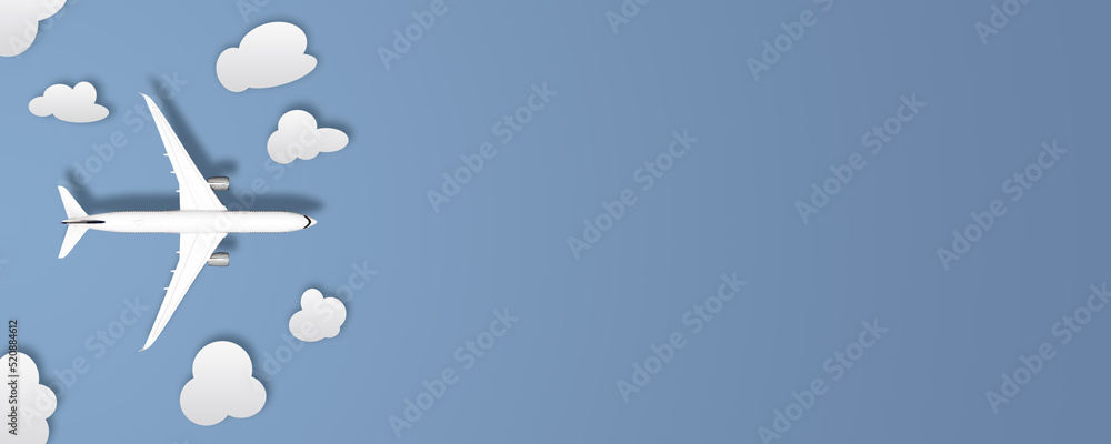 Flat lay or table top picture of aircraft with clouds as paper cut outs ...