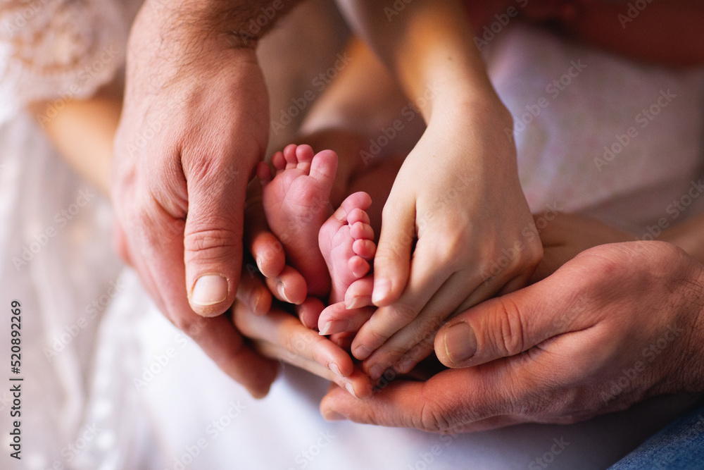 Family with baby holding hands together at home Stock Photo | Adobe Stock