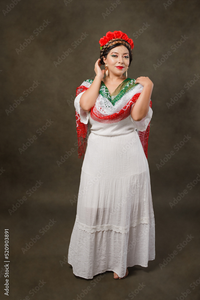Full length female studio portrait of Mexican woman with scarf with the ...