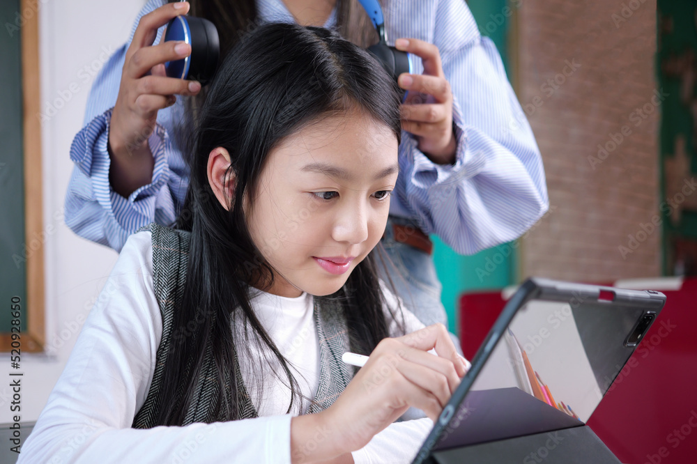 Student in the classroom portrait, Girl student using tablet to search ...
