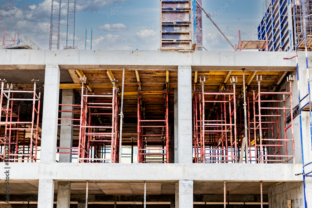 Construction of a new monolithic reinforced concrete house. Scaffolding ...