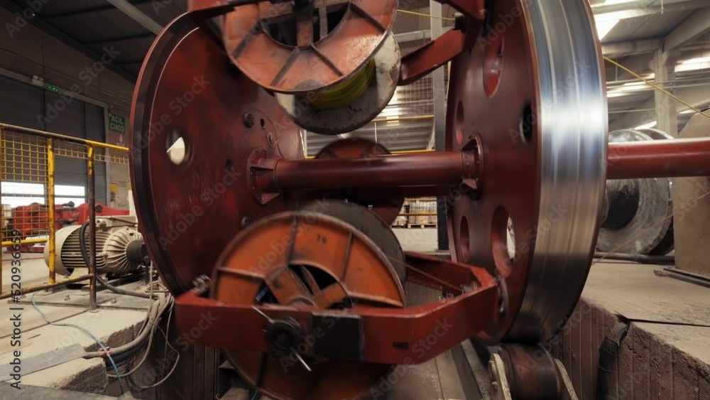 Cable factory. Winding of the electrical cable to the bobbin in the ...