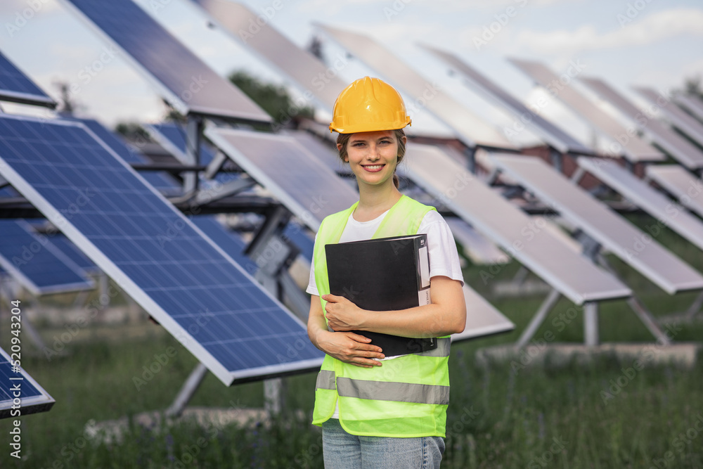 Large smiling ecological engineer woman posing in the middle of ...