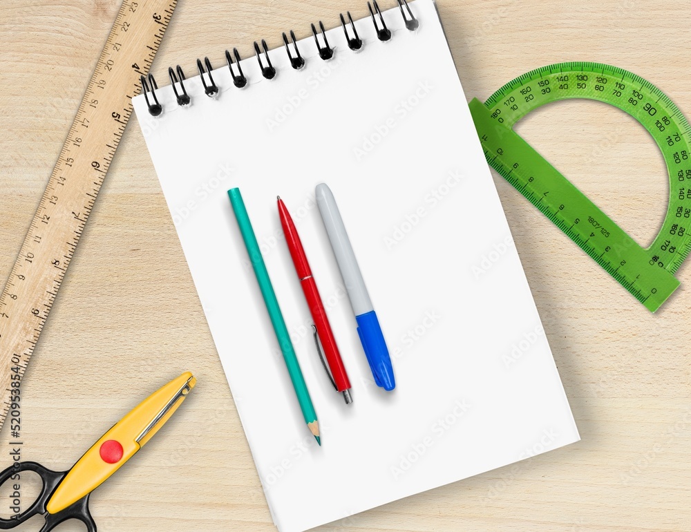 School stationery on background. Colorful math fractions, rulers, open ...