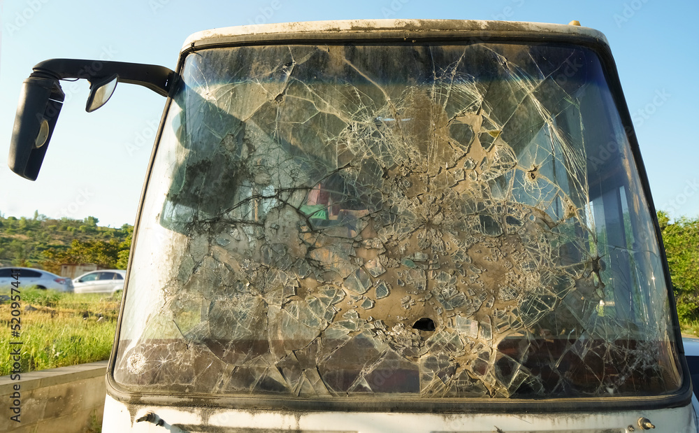 Shattered Window at a Wrecked Bus. abandoned windshield. Abandoned old ...