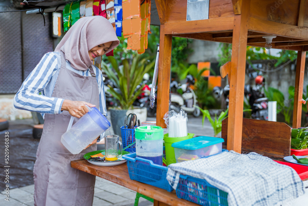 muslim couple ordering food to break fasting in traditional food market ...
