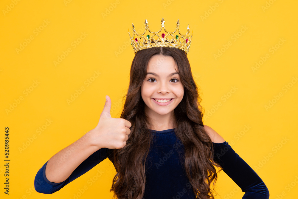 Girls birthday party, funny kid in crown. Imagine herself a queen ...