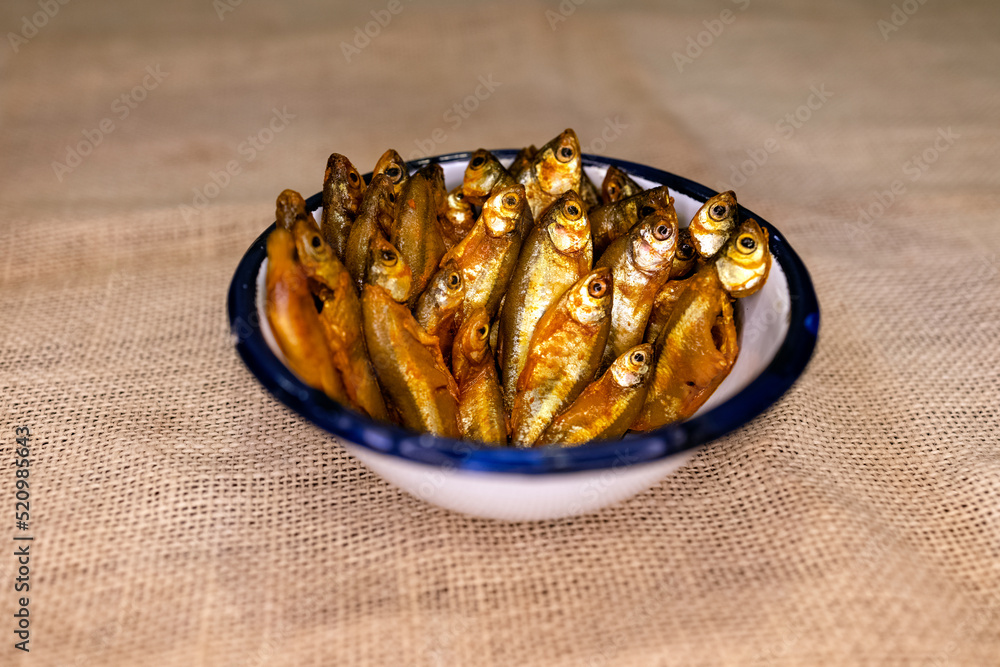 Mourala fish or indian carplet fish cooked in yellow gravy in white ...