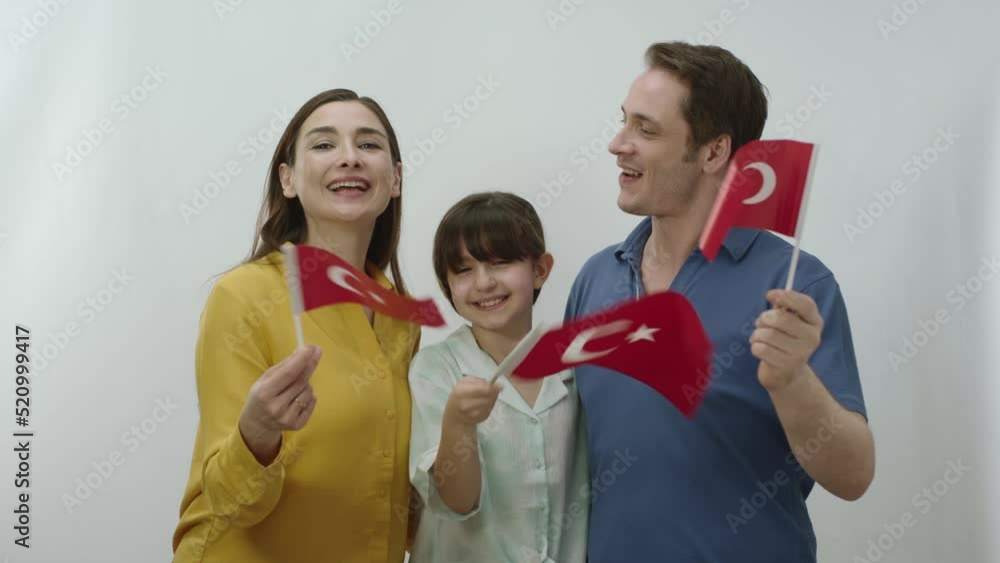 Young family celebrating with the Turkish flag and celebrating the ...