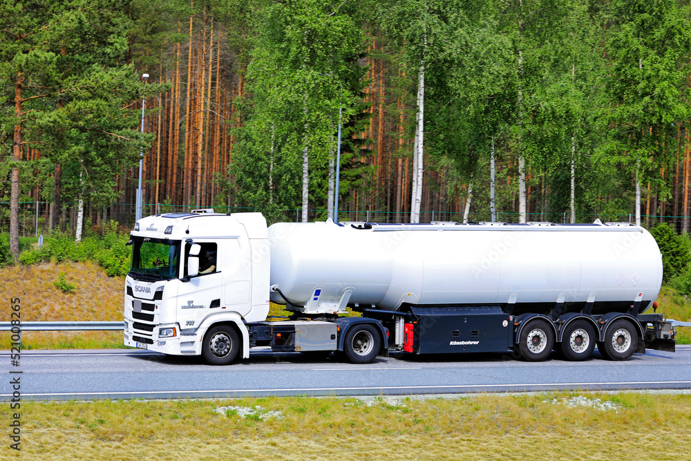 White Scania truck Simeon pulls Kaessbohrer semi tank trailer on ...