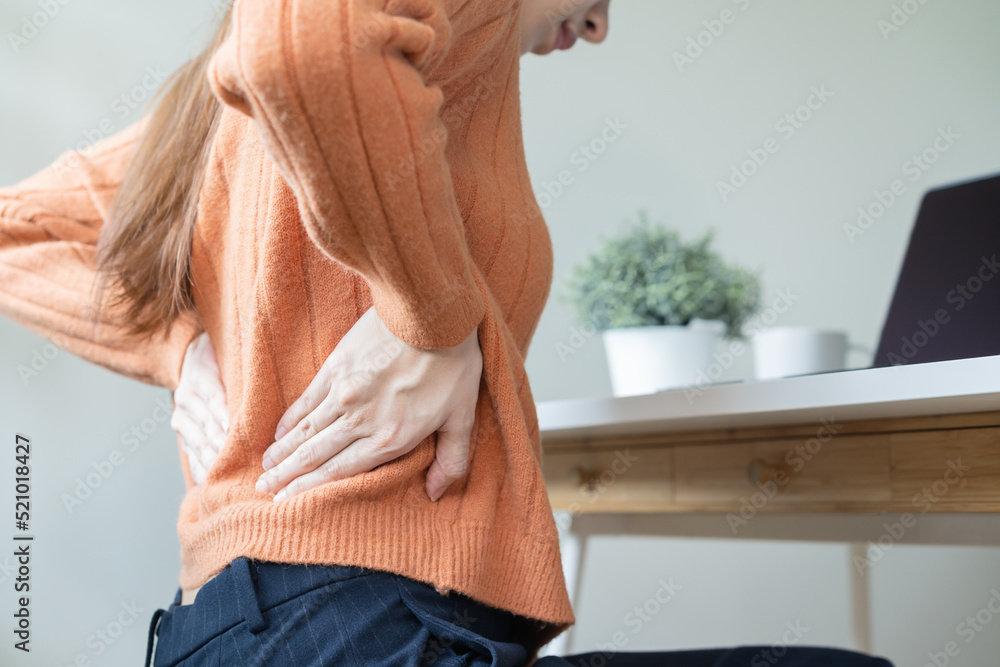 office syndrome, woman with back pain symptoms during work in the ...