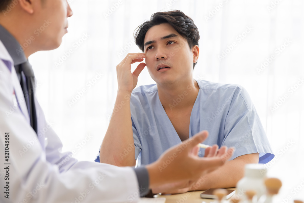 Professional doctor interacting with patient sitting on chair, Male ...