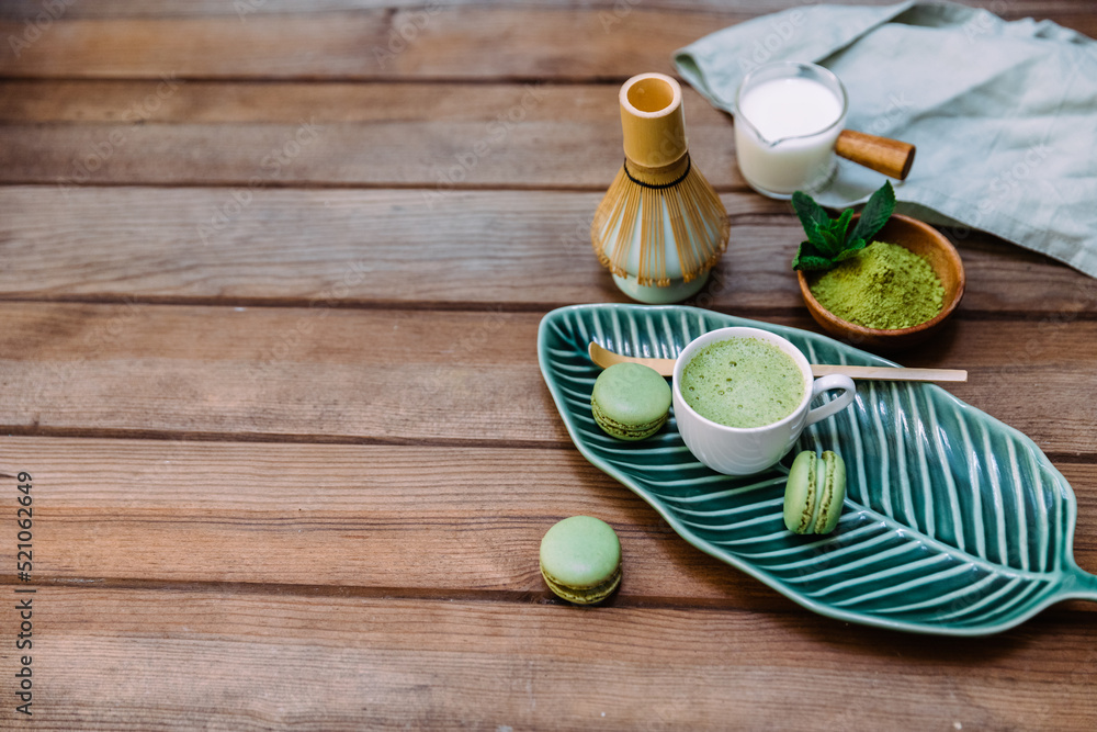 Japanese green matcha latte, matcha powder, bamboo whisk for whipping ...