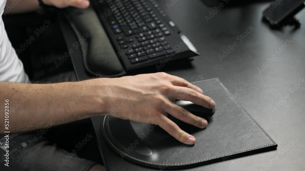 Black computer mouse on the desktop. Working with a PC and how to hold ...