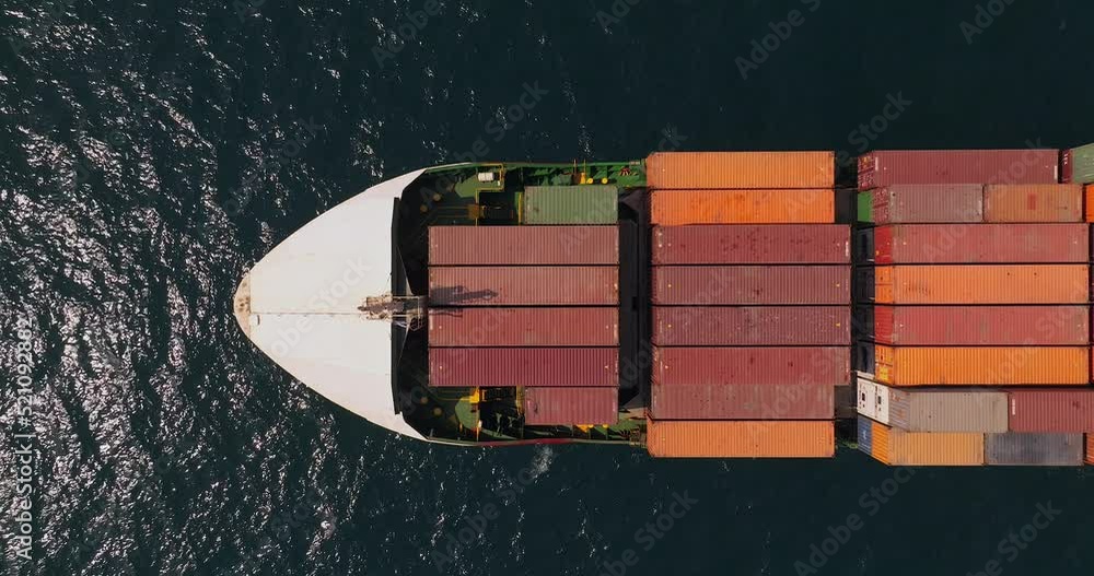 Container ship loaded with Shipping containers holding position at sea. Stock Video | Adobe Stock