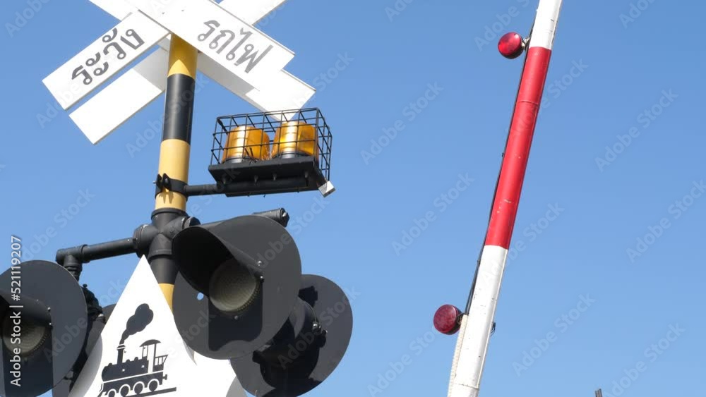 Close up of crossing railroad warning signpost with train symbol, light ...