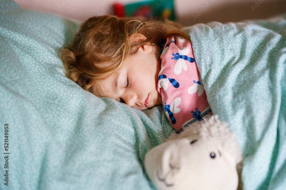 Cute little preschool girl sleeping in bed. Tired preschool child ...