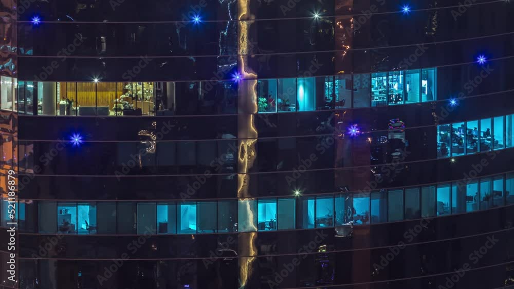 Office windows lights in modern tower buildings timelapse at night ...
