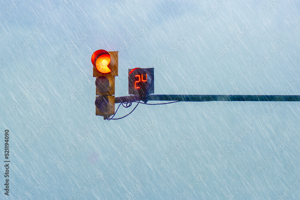 red traffic light with countdown on rainy day Stock Photo | Adobe Stock