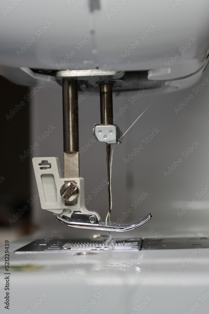 zoomed plan of a sewing machine foot Stock Photo | Adobe Stock