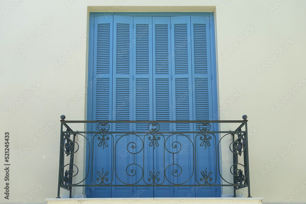 neoclassical balcony railing and wooden shutter Stock Photo | Adobe Stock
