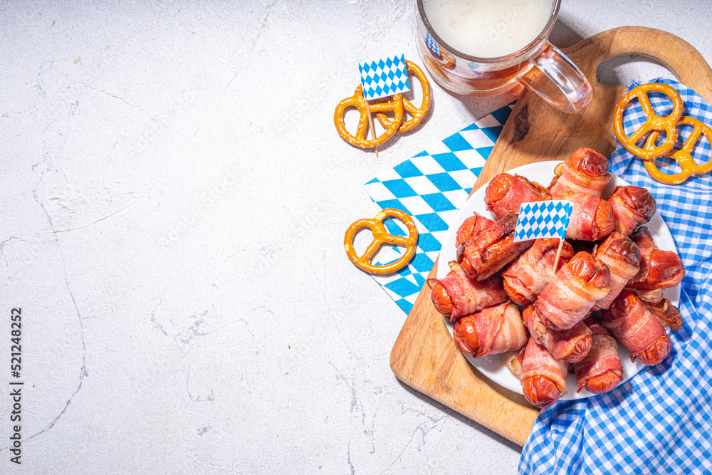 Oktoberfest party food. Pretzel hot dogs, puff pastry rolls with ...