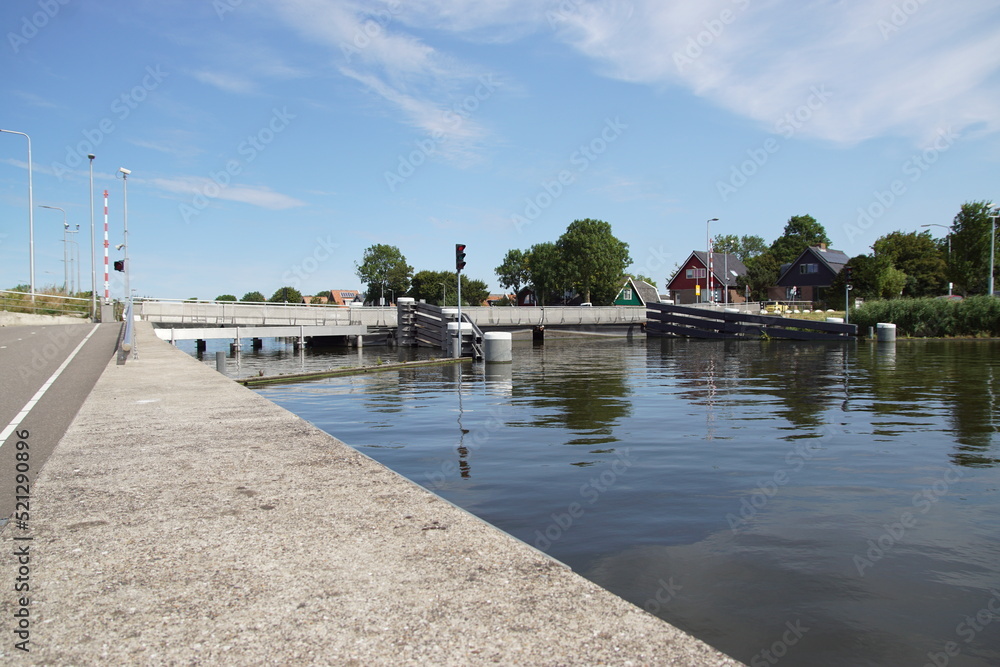New float bridge Rekervlotbrug with cycle path in a canal in the Dutch ...