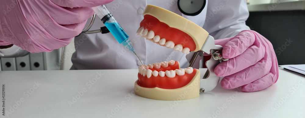 Pain relieving tooth injections. Injection of anesthetic into gum and ...