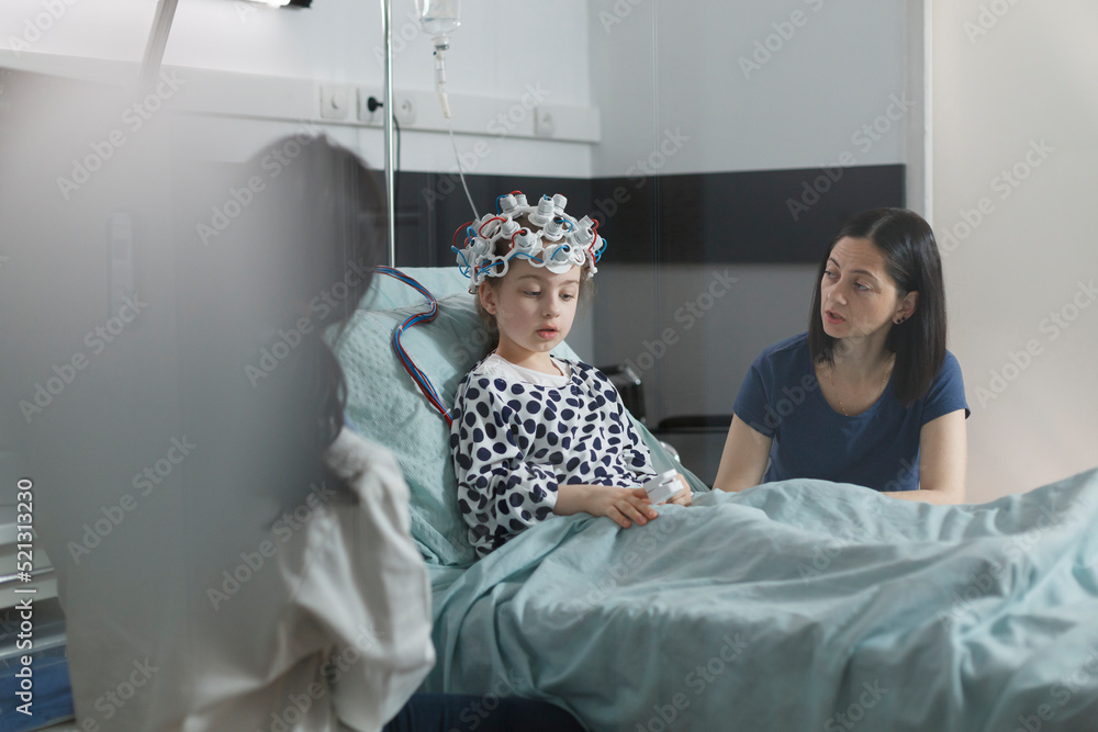 Neurology specialist examining neurological disease state of ill kid ...