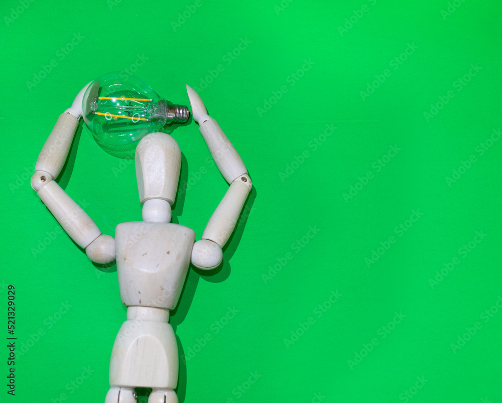 Mannequin Wood Figure carrying an incandescent light bulb. New idea ...
