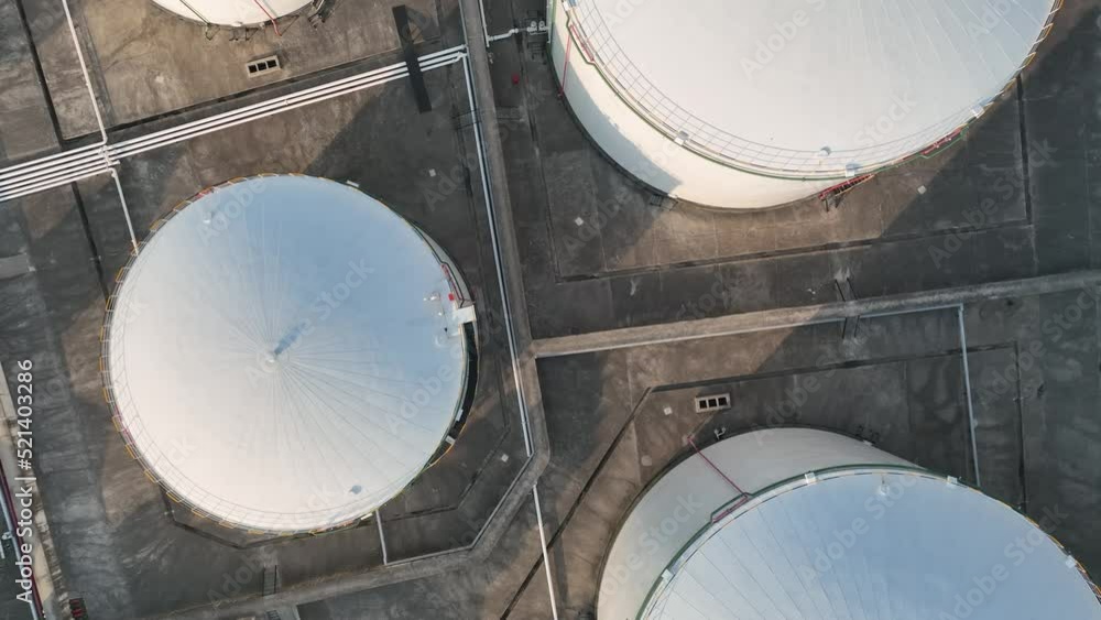 Oil storage tanks in rows in the factory. Drone aerial view. Oil ...