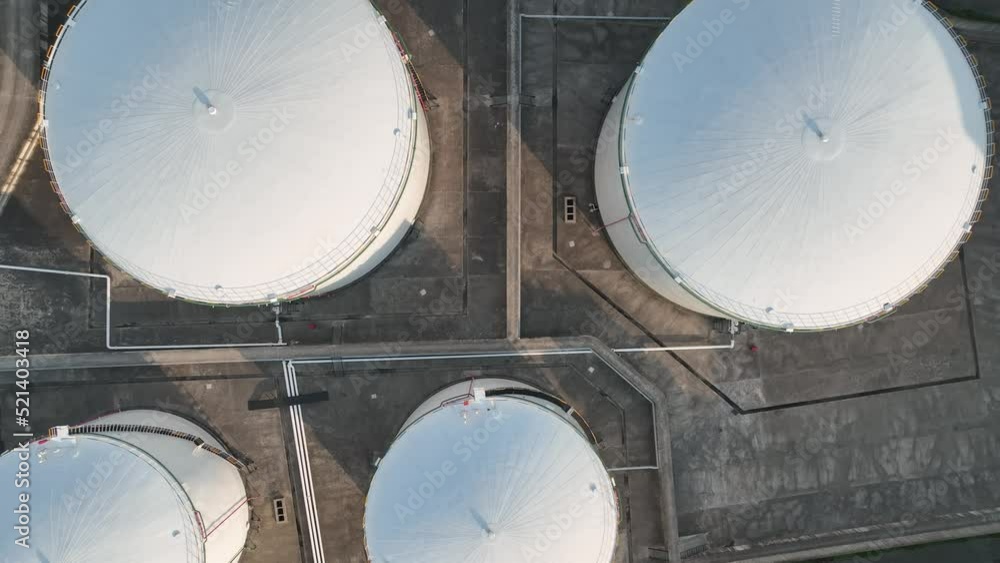 Oil storage tanks in rows in the factory. Drone aerial view. Oil ...