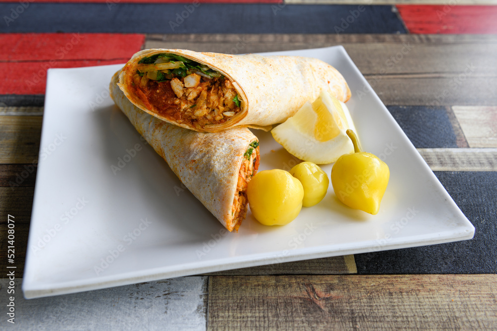 Lavash doner kebab ( doner zurna durum ) or shawarma sliced in plate ...