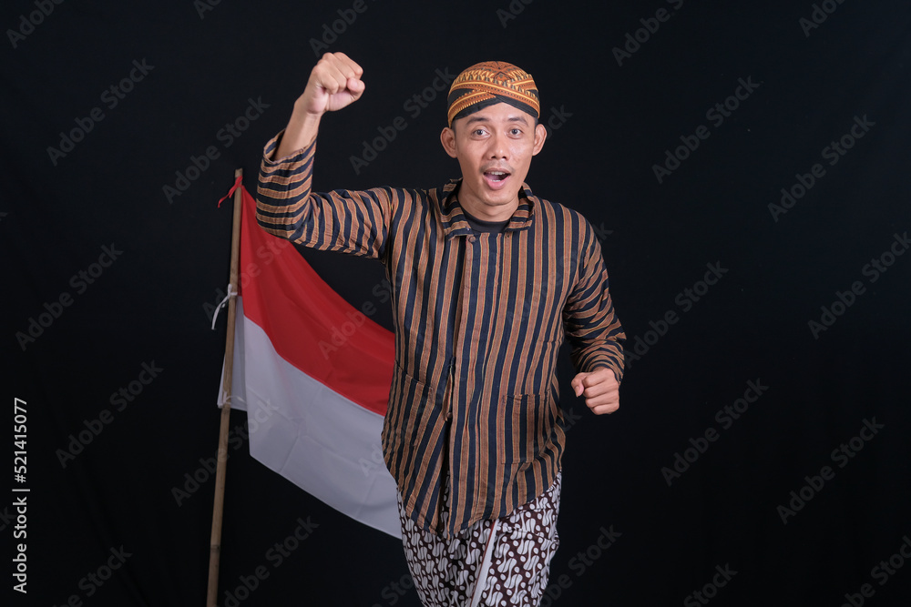 Men wearing traditional Javanese batik clothes to show the richness of ...