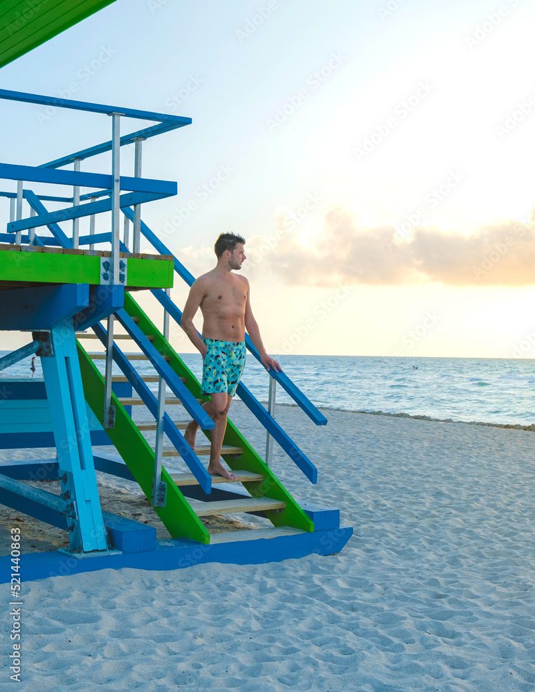 Miami beach, young men on the beach, lifeguard hut Miami beach Florida ...